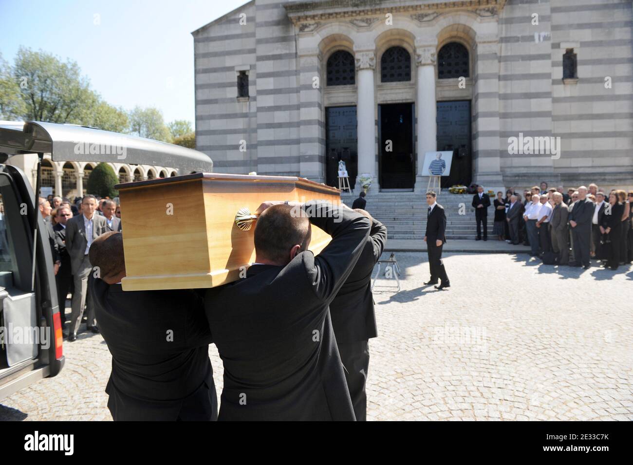 The coffin of French cycling champion Laurent Fignon is carried during ...
