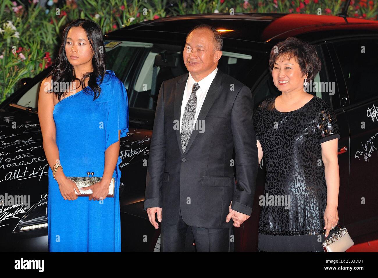 Director John Woo with wife Annie Woo and daughter Angeles Woo arriving ...