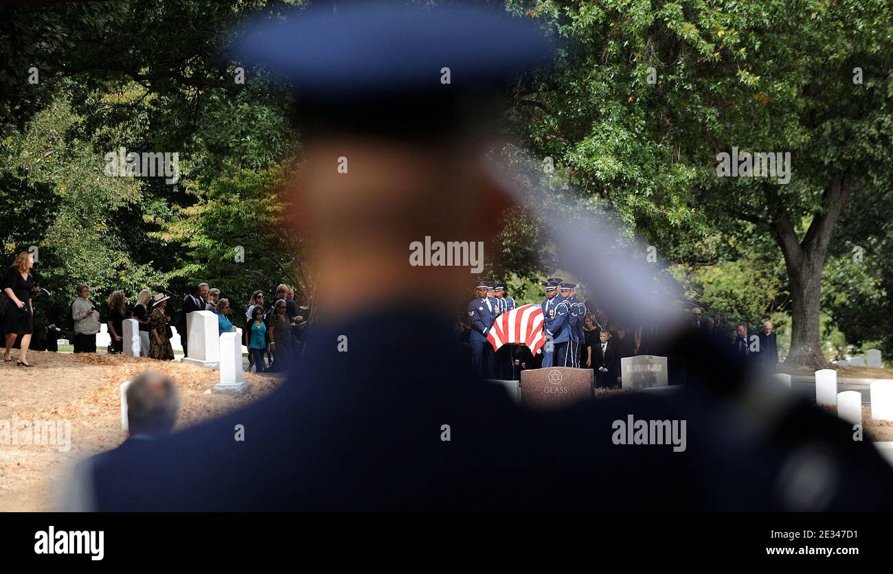 A military personel salutes as the casket of former Alaska Senator Ted ...