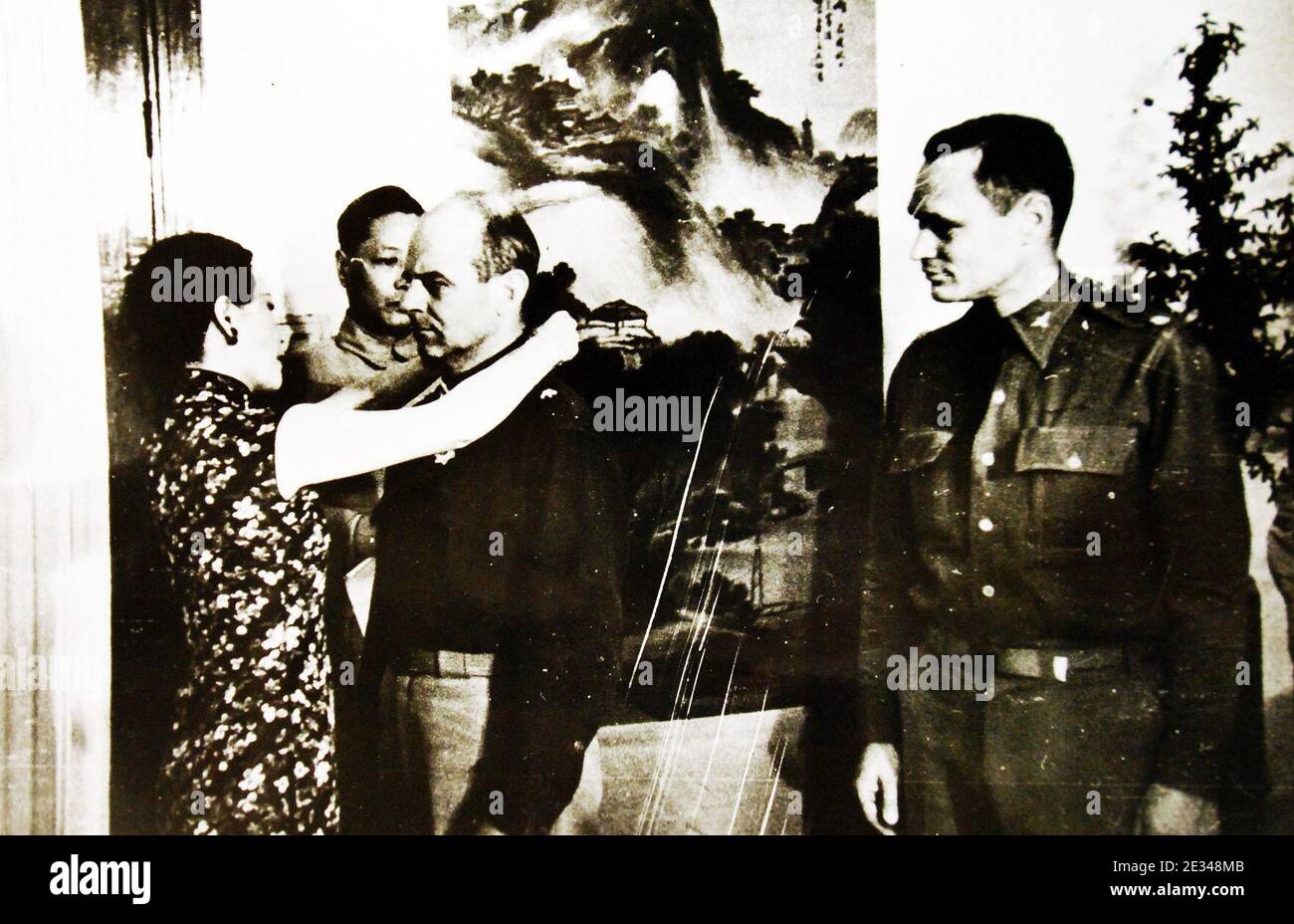 Madame Chiang Kai-shek awarding the Military Order of China to BG James ...