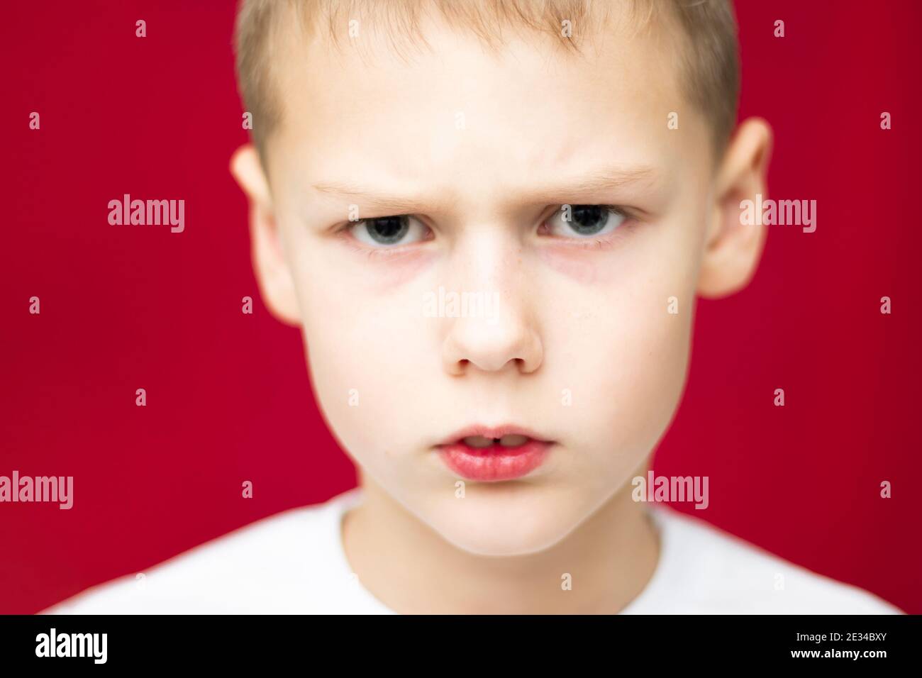 Kid frowning hi-res stock photography and images - Alamy