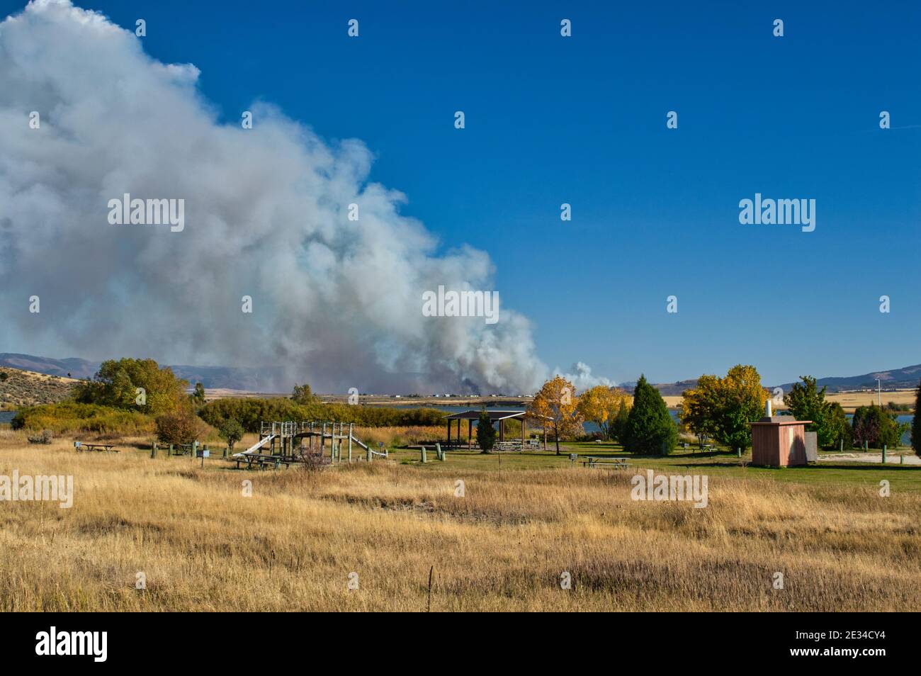 Country landscape with smoke in the background Stock Photo - Alamy