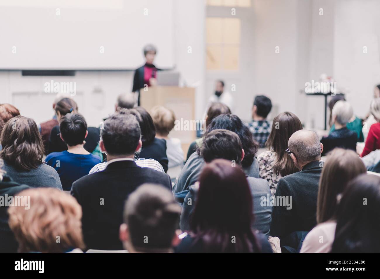 Woman giving presentation on business conference Stock Photo - Alamy