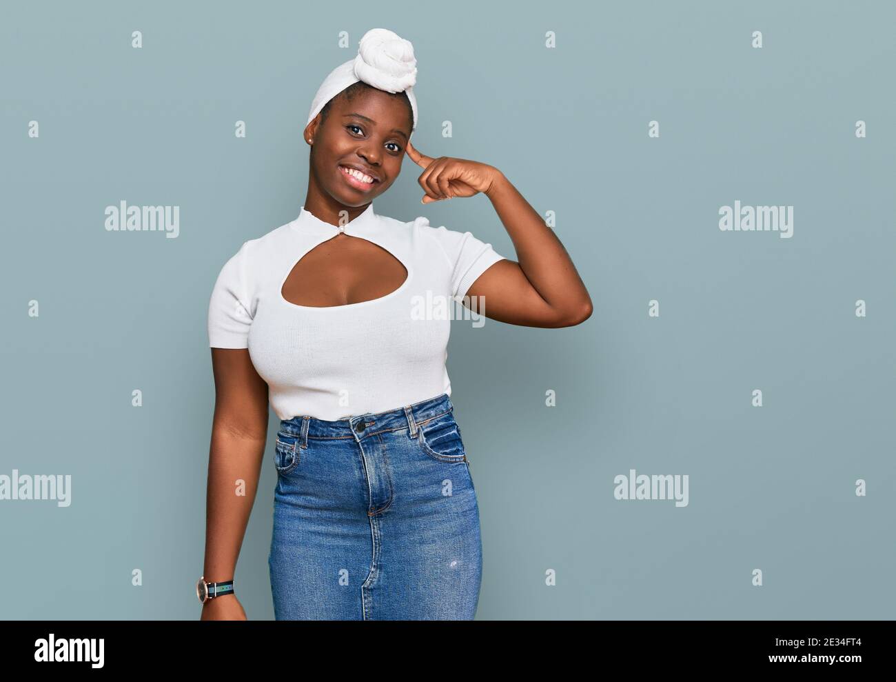Young african woman with turban wearing hair turban over isolated ...
