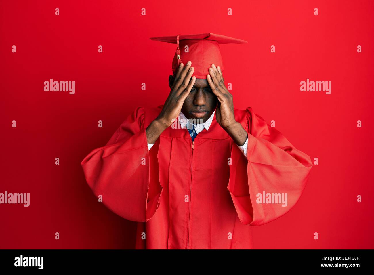 Young african american man wearing graduation cap and ceremony robe ...