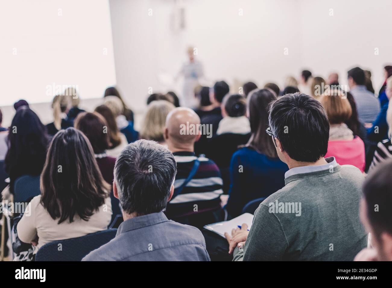 Woman giving presentation on business conference Stock Photo - Alamy