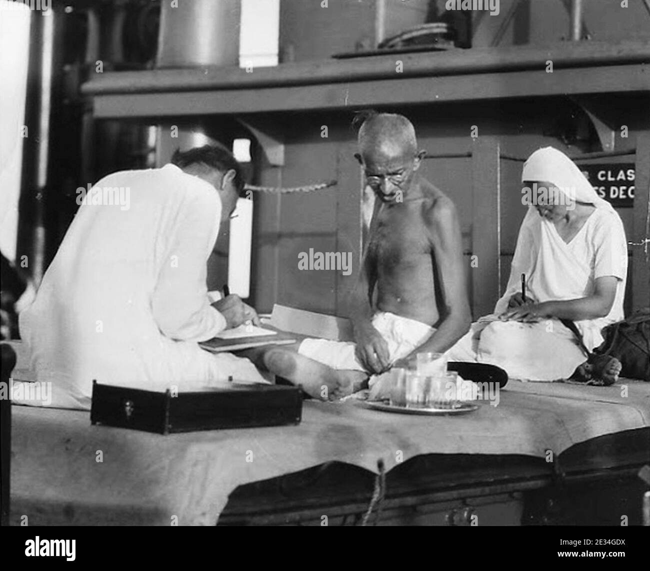Mahatma Gandhi at work during his voyage from India to London - 1931 ...