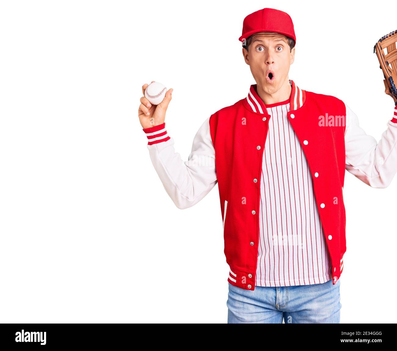 Young handsome man wearing baseball uniform holding golve and ball ...