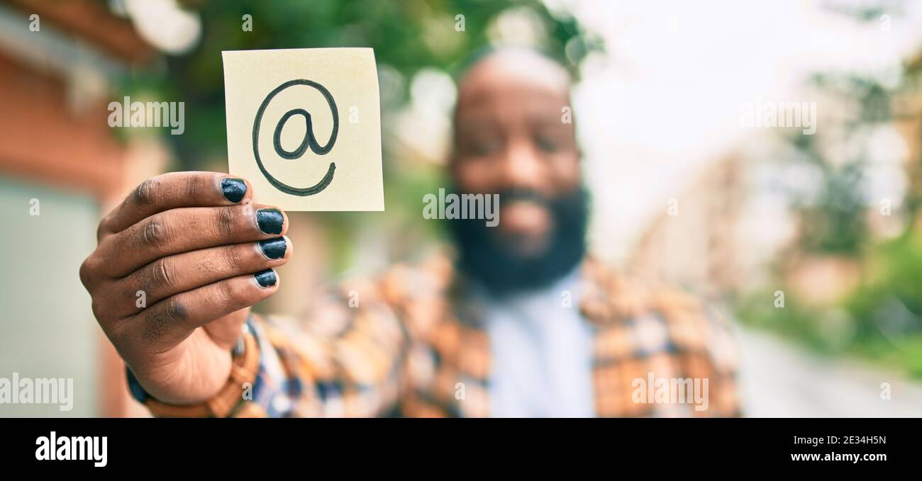 Handsome modern african american man with beard smiling positive ...