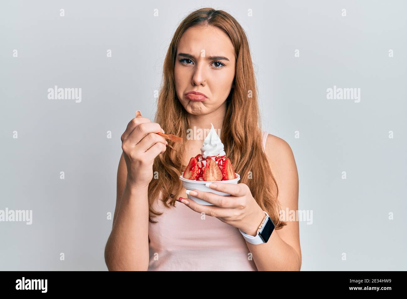 Sad woman eating ice cream hi-res stock photography and images - Alamy