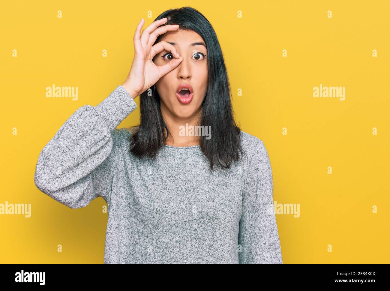 Beautiful asian young woman wearing casual clothes doing ok gesture ...