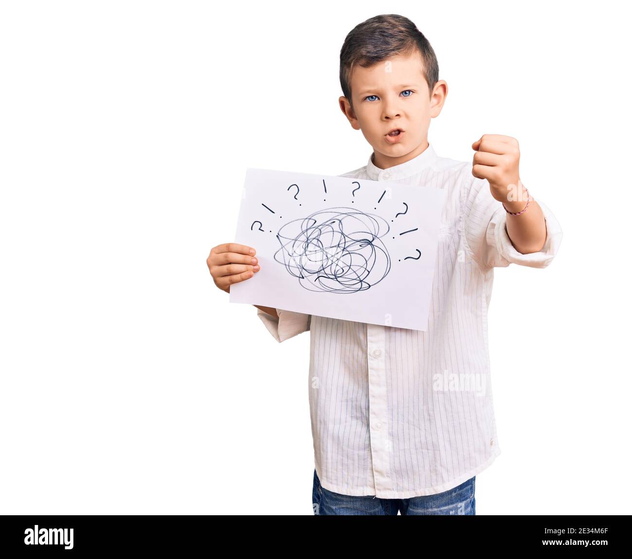 Cute blond kid holding scribble draw annoyed and frustrated shouting ...