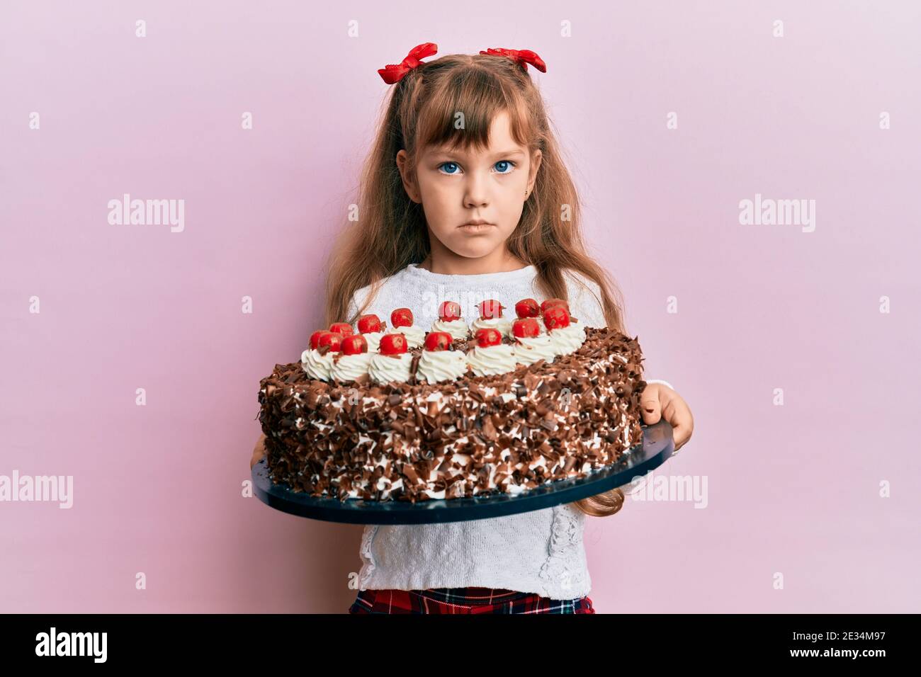 Little caucasian girl kid celebrating birthday holding big chocolate ...