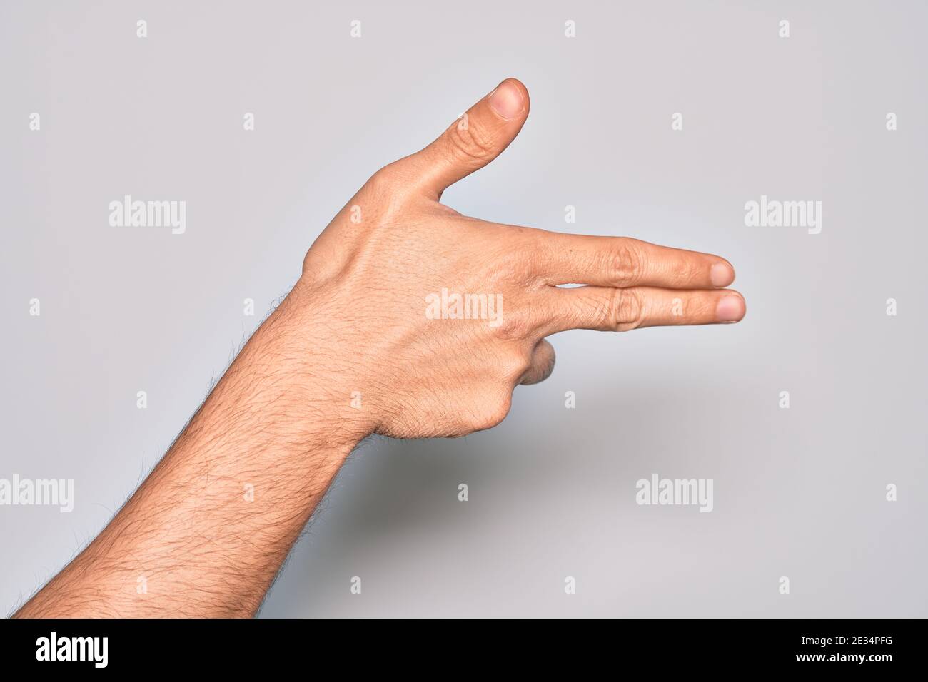 Hand of caucasian young man showing fingers over isolated white ...