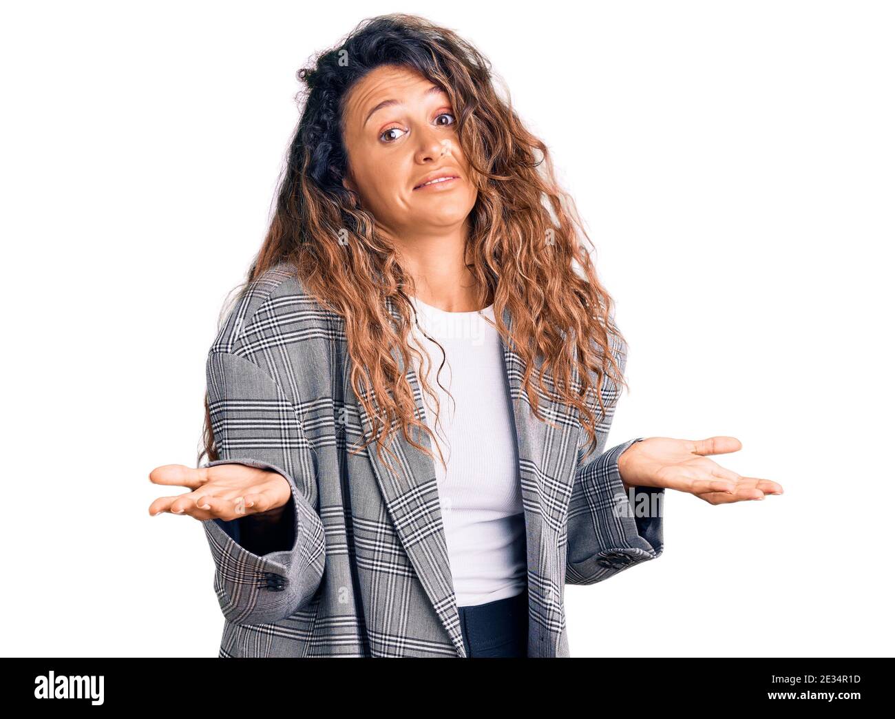 Young hispanic woman with tattoo wearing business oversize jacket ...