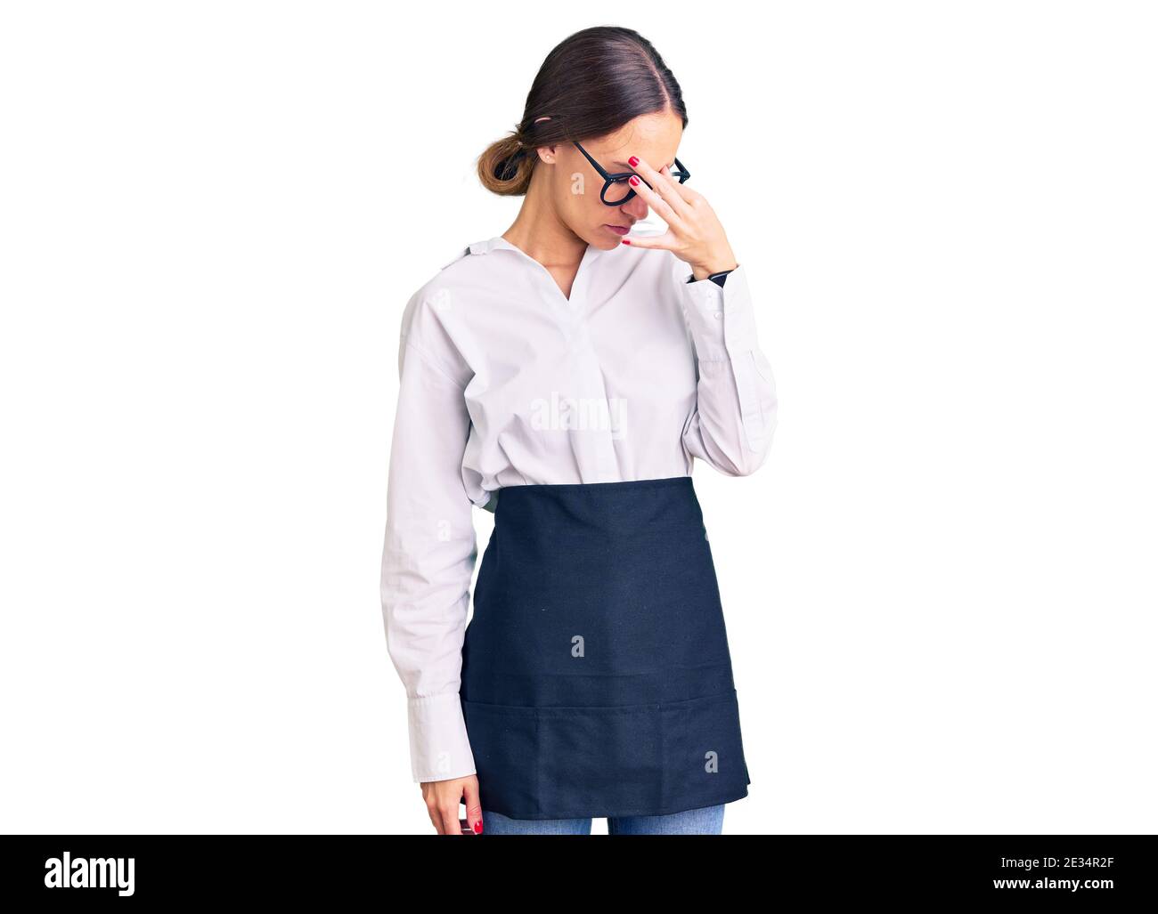 Beautiful brunette young woman wearing professional waitress apron ...