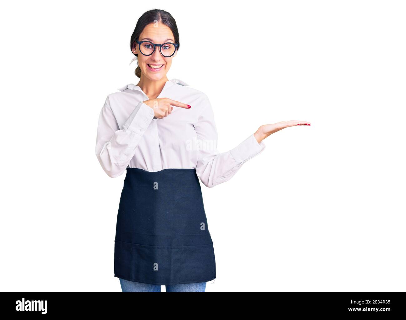 Beautiful brunette young woman wearing professional waitress apron ...