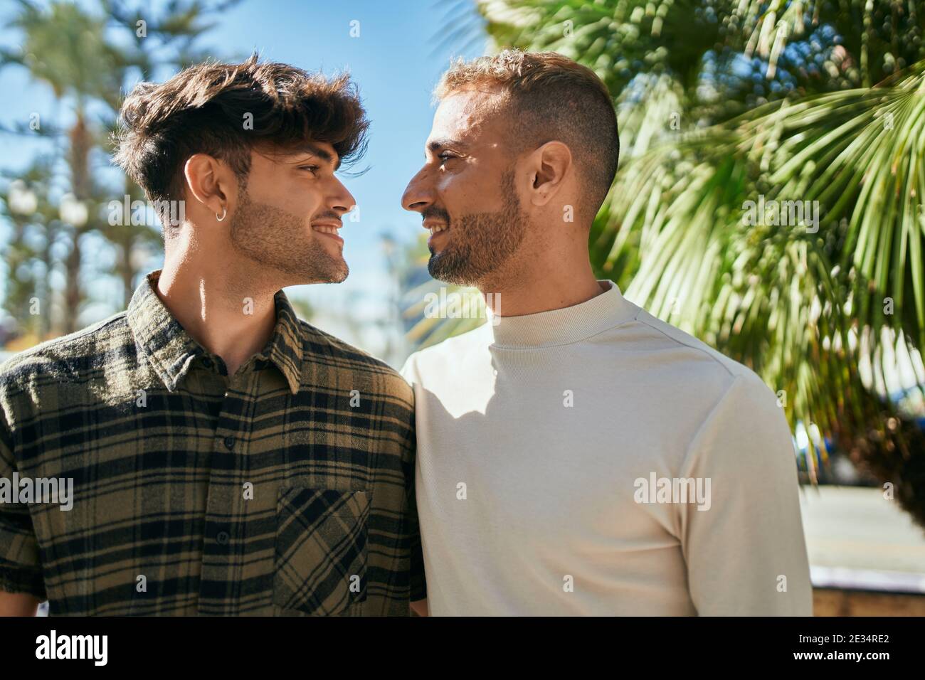 Young gay couple smiling happy and hugging at the city Stock Photo - Alamy