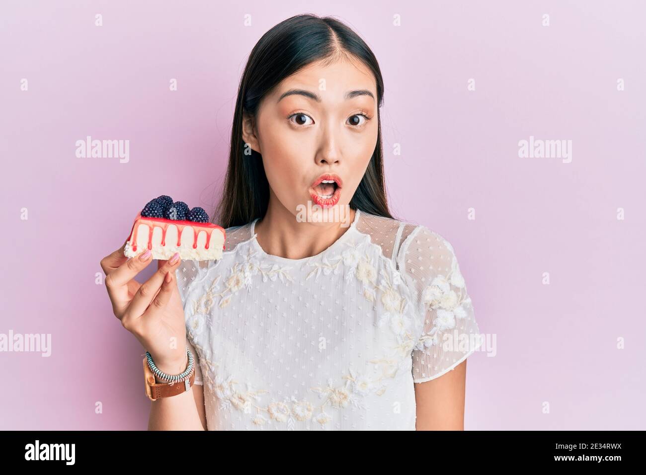Woman eating cake worried hi-res stock photography and images - Alamy