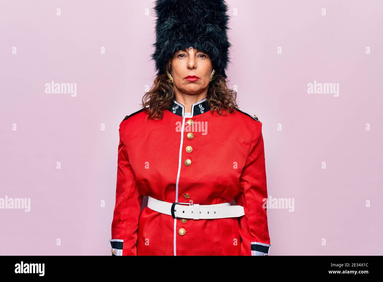 Middle age beautiful wales guard woman wearing traditional uniform over ...