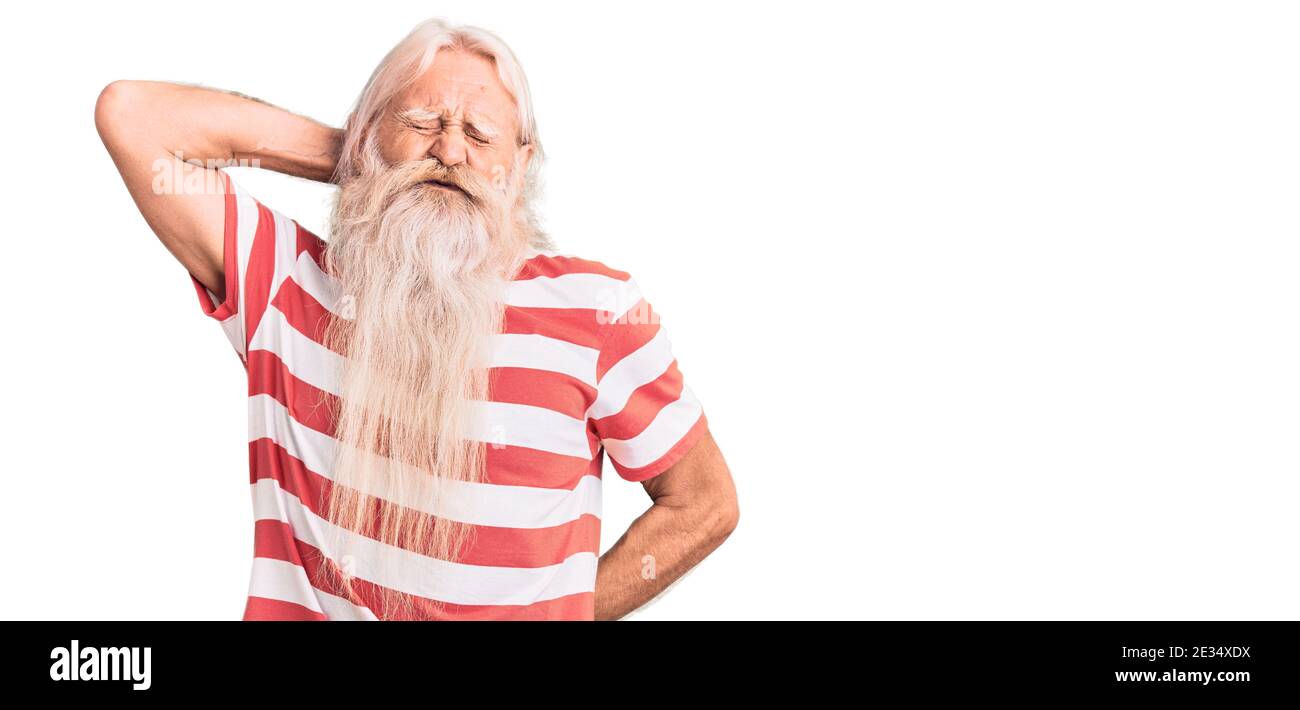 Old senior man with grey hair and long beard wearing striped tshirt ...