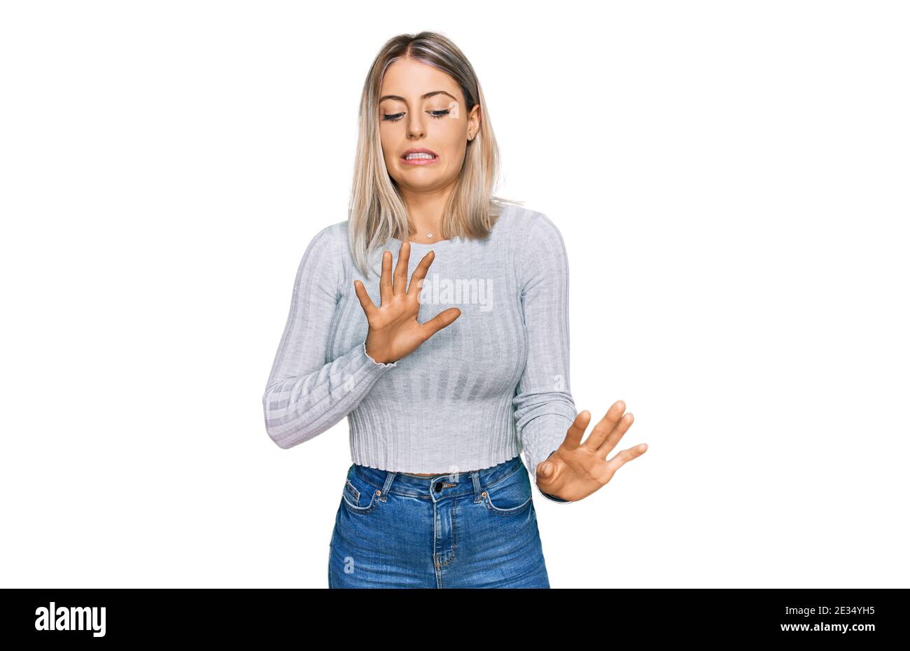 Beautiful blonde woman wearing casual clothes disgusted expression ...