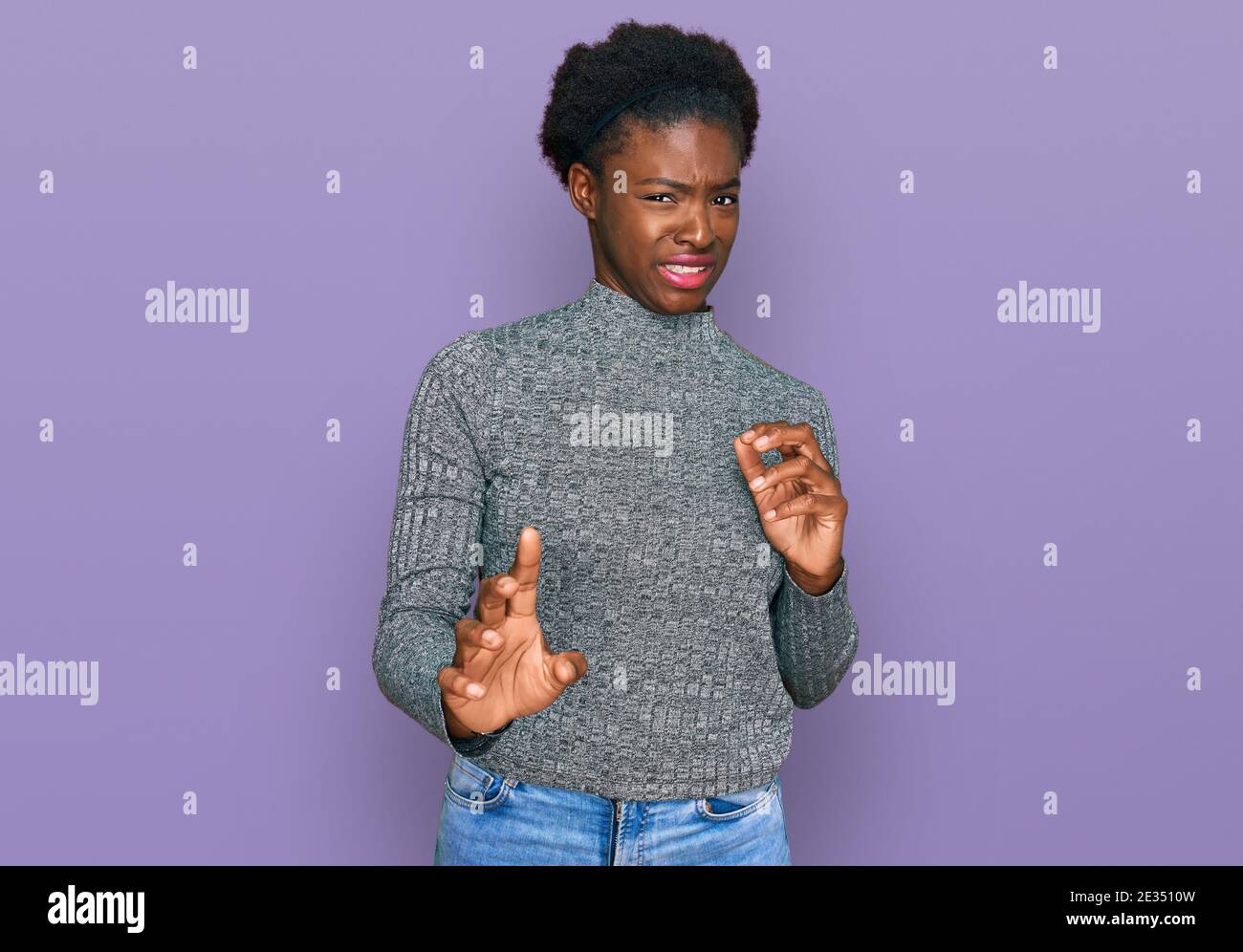 Young african american girl wearing casual clothes disgusted expression ...