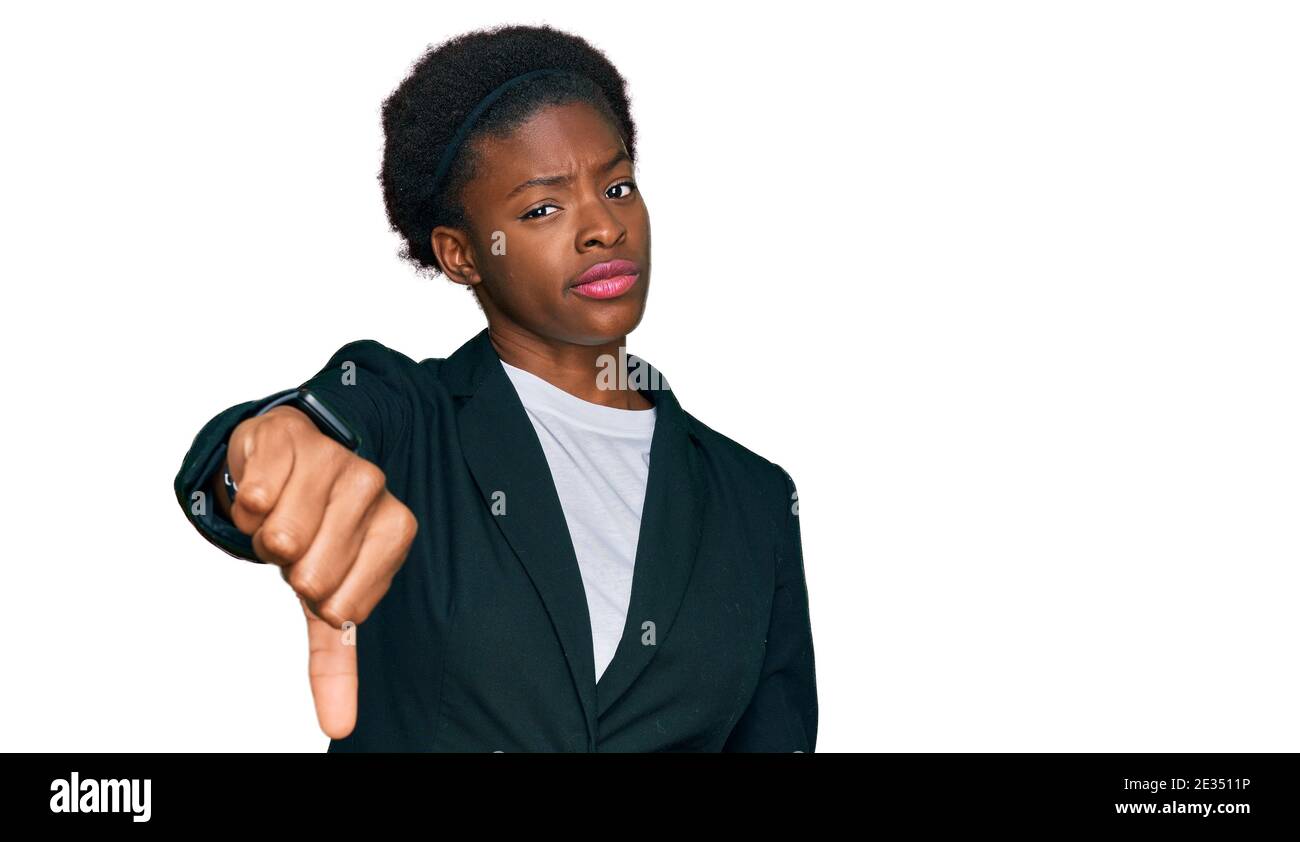 Young african american girl wearing business clothes looking unhappy ...