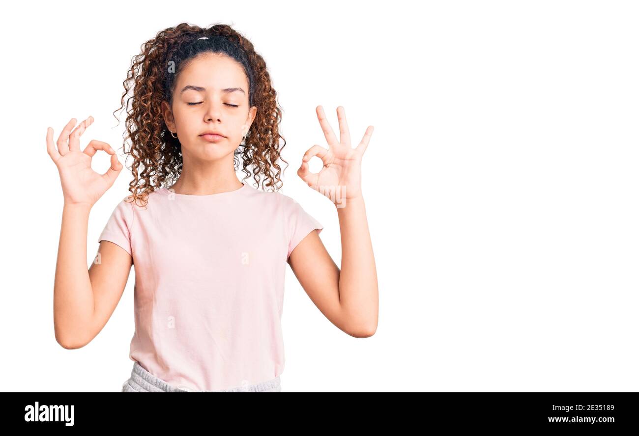 Beautiful kid girl with curly hair wearing casual clothes relax and ...