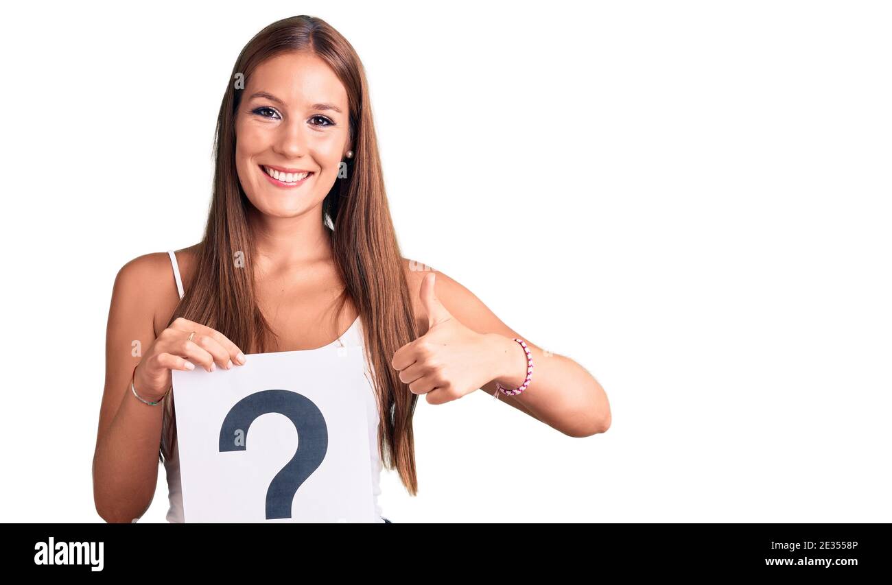 Young beautiful hispanic woman holding question mark smiling happy and ...