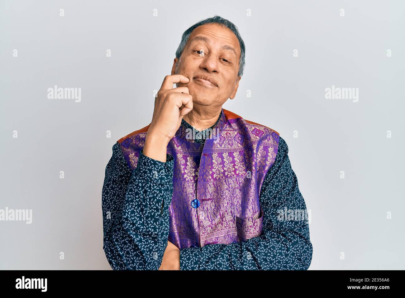 Middle age indian man wearing traditional indian clothes thinking ...