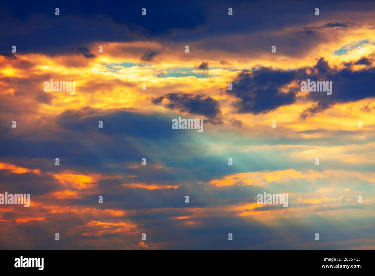 Sun rays in colorful clouds . Fantastic sky in the dusk Stock Photo - Alamy