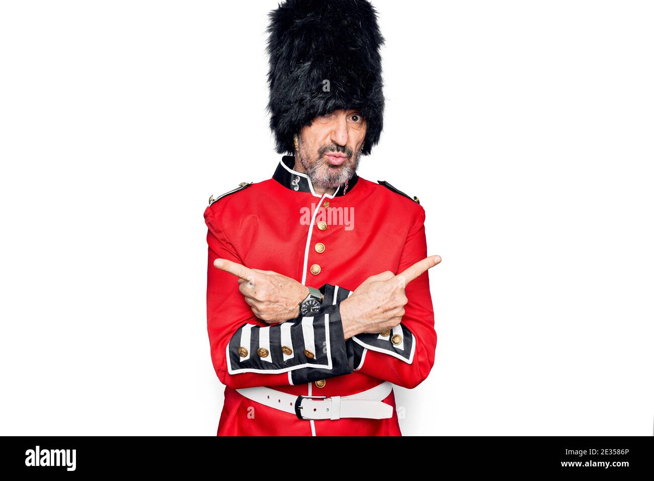 Middle age handsome wales guard man wearing traditional uniform over ...