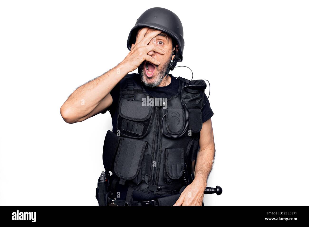 Middle age handsome policeman wearing police bulletproof vest and ...