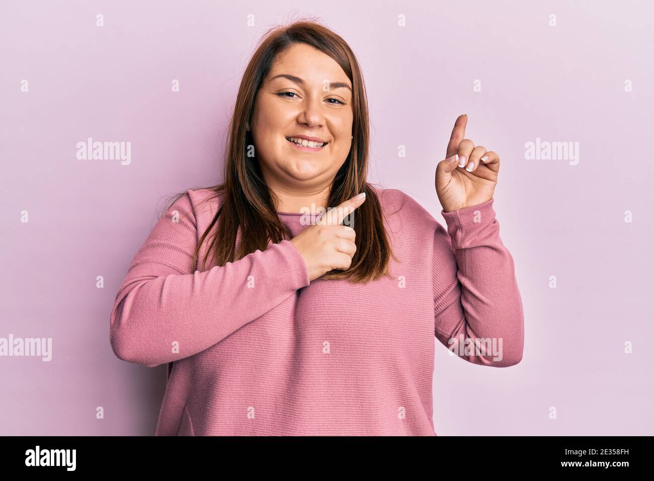 Beautiful brunette plus size woman wearing casual winter sweater ...