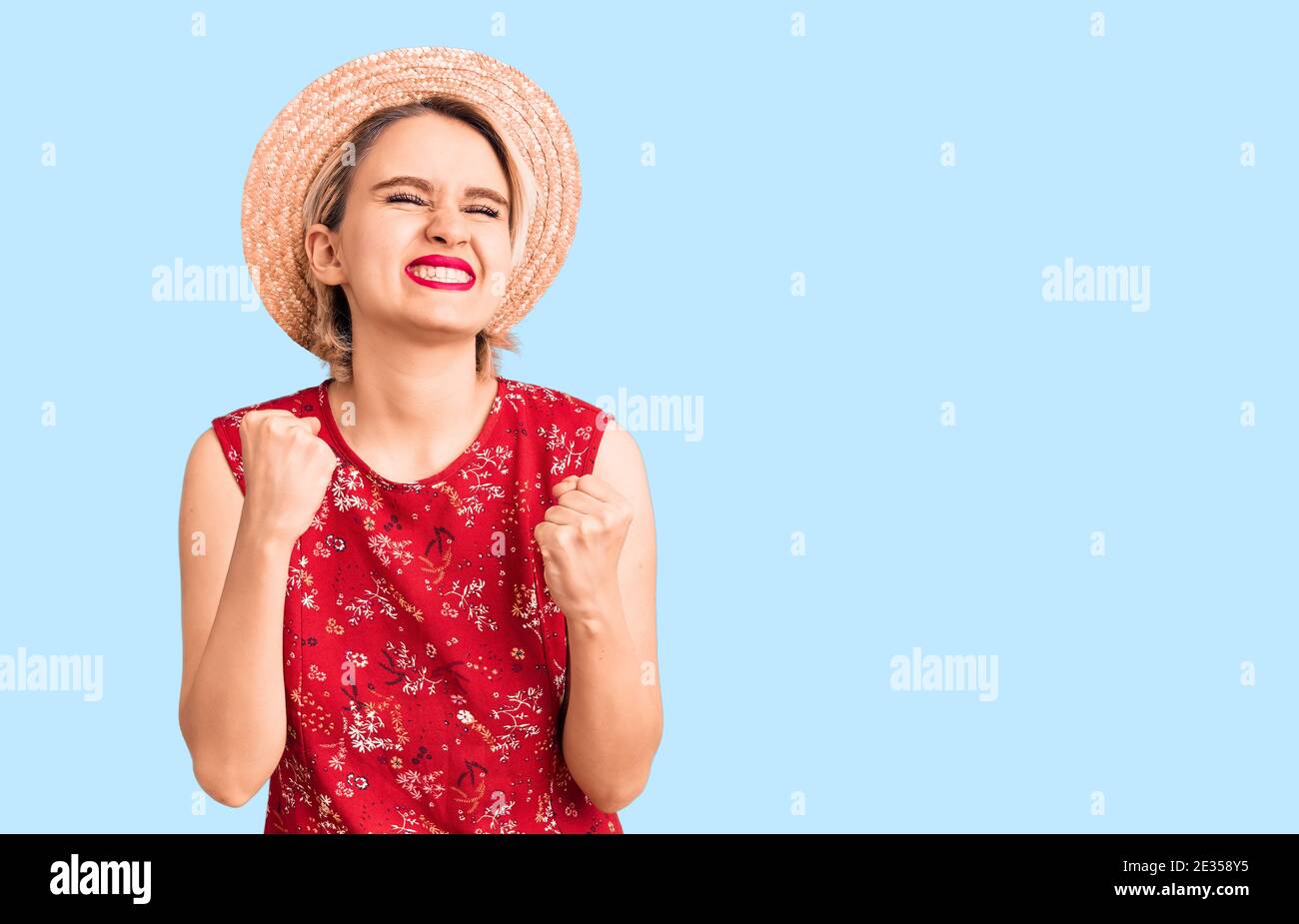 Standing smiling winning hat success hi-res stock photography and ...
