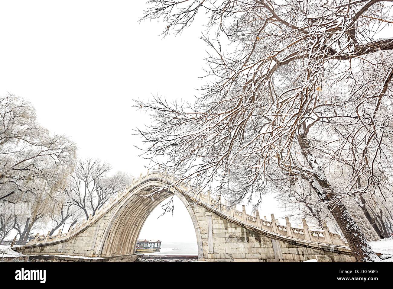 The arch bridge in Summer Palace in the snow Stock Photo - Alamy