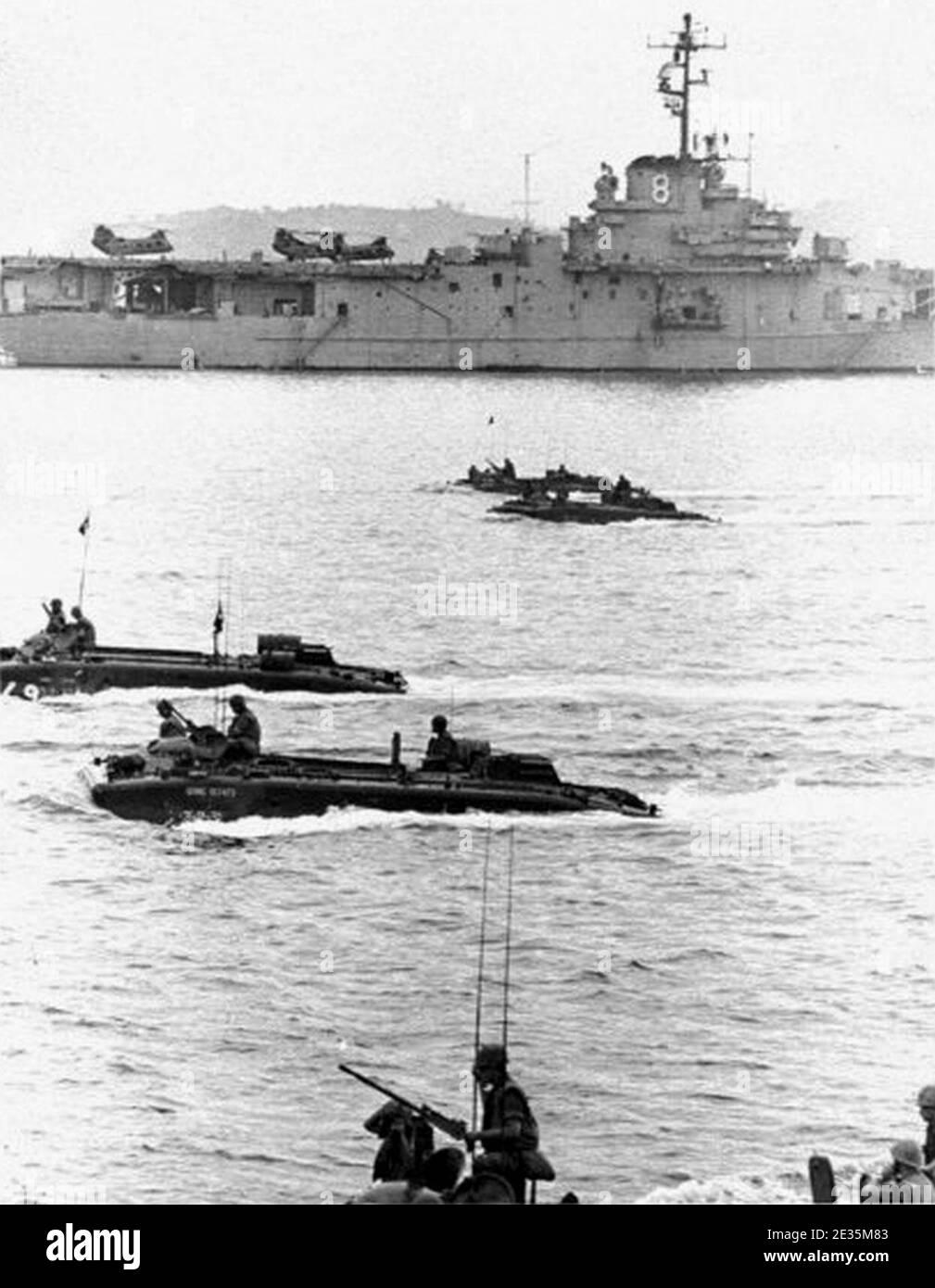 LVT-5 Amtracs pass USS Valley Forge (LPH-8) in 1968 Stock Photo - Alamy