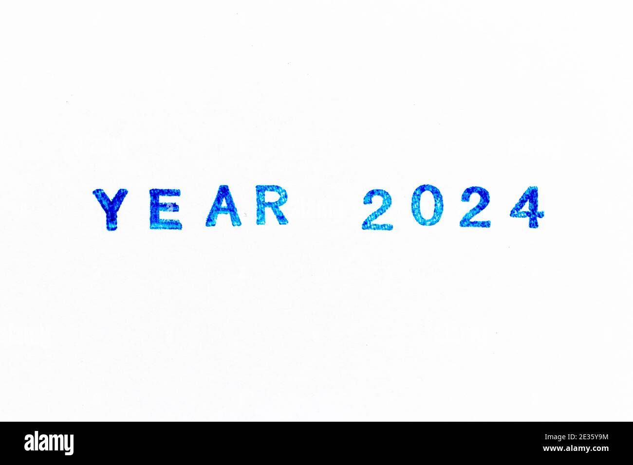 Blue color ink of rubber stamp in word year 2024 on white paper ...