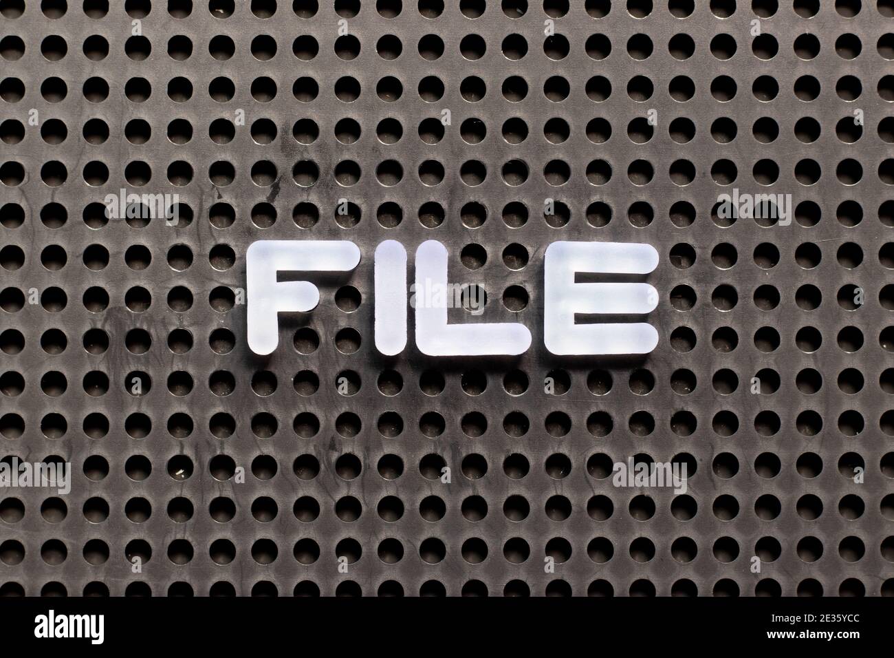 White color letter in word file on black pegboard background Stock ...