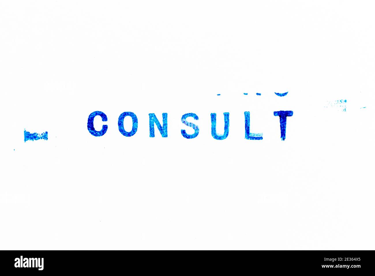 Blue color ink of rubber stamp in word consult on white paper ...