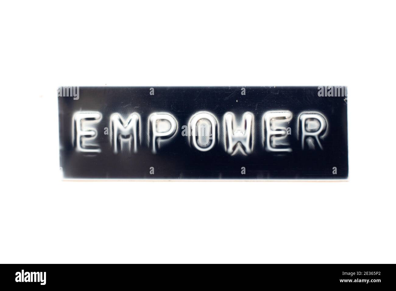 Embossed letter in word empower on black banner with white background ...