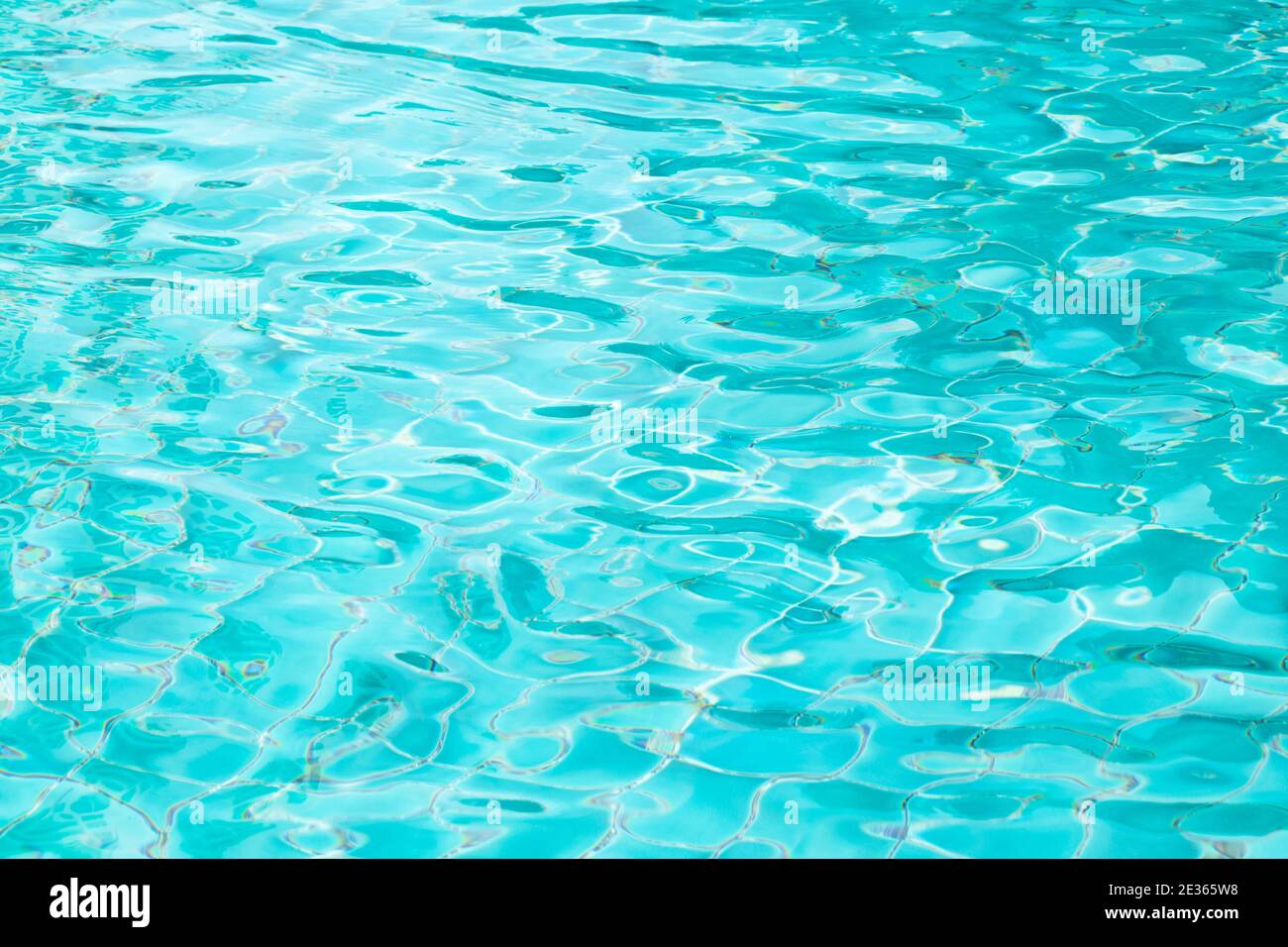 Ripple Water in swimming pool with blue tile floor background Stock ...