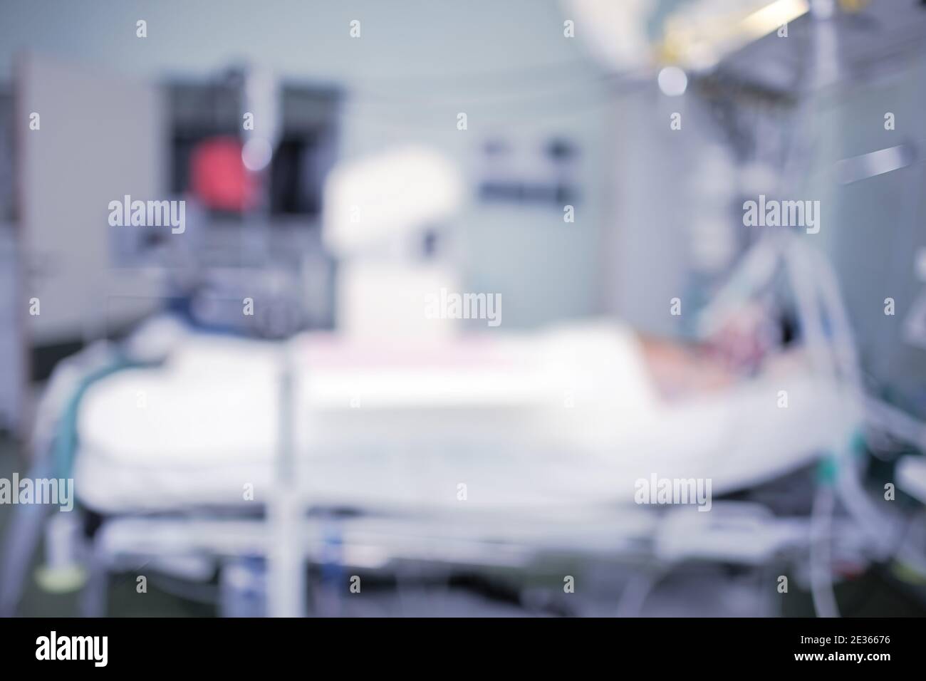 Critical care unit with patient, unfocused background Stock Photo - Alamy