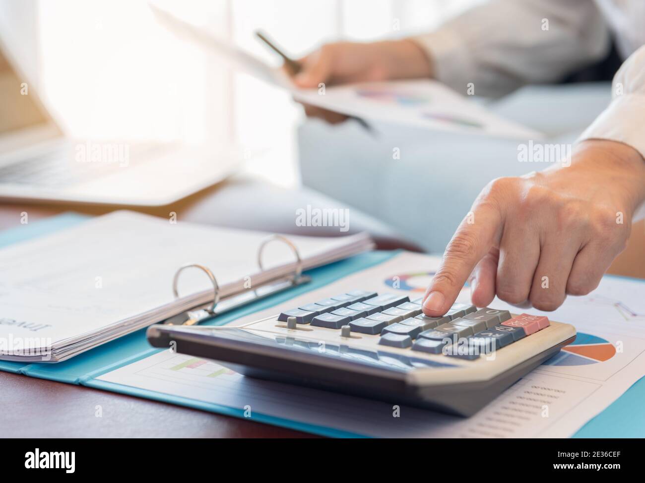 Business people using a calculator to calculate the numbers. Accounting ...