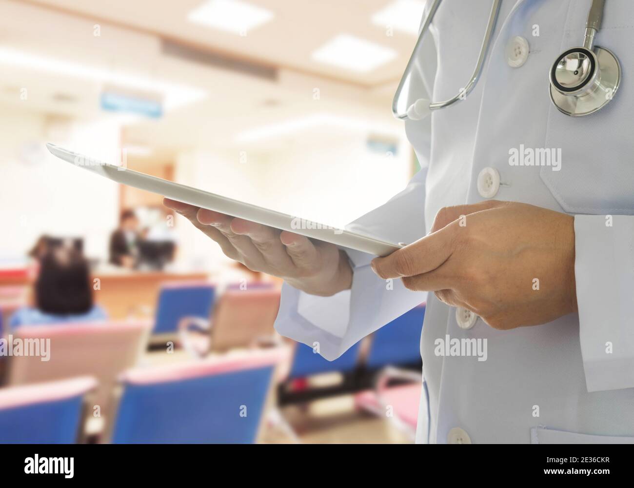 Doctor using a digital tablet computer in hospital. Healthcare And ...