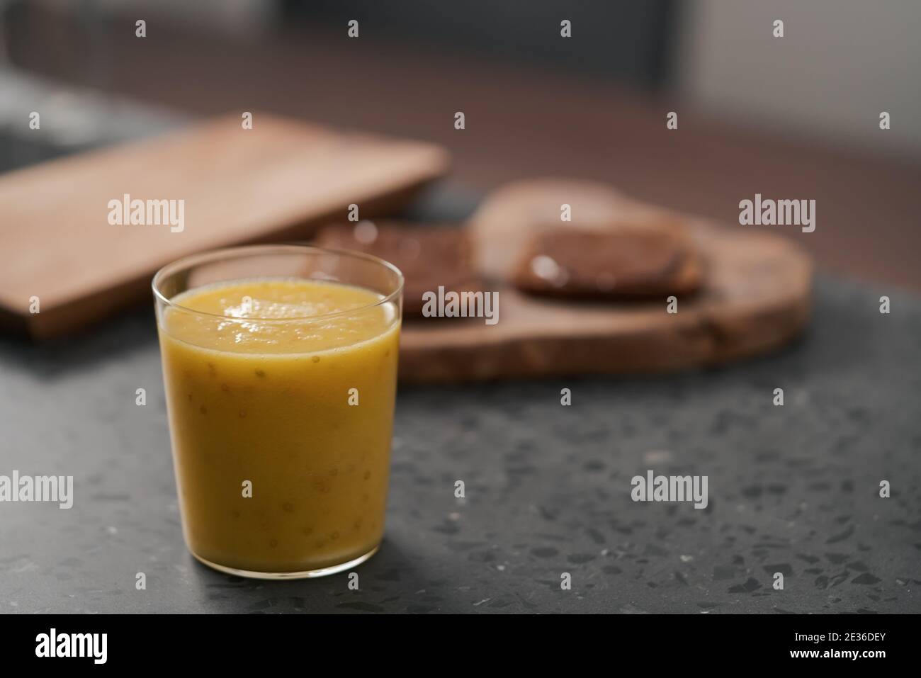 Fresh mango lulo smoothie on kitchen countertop, shallow focus Stock ...
