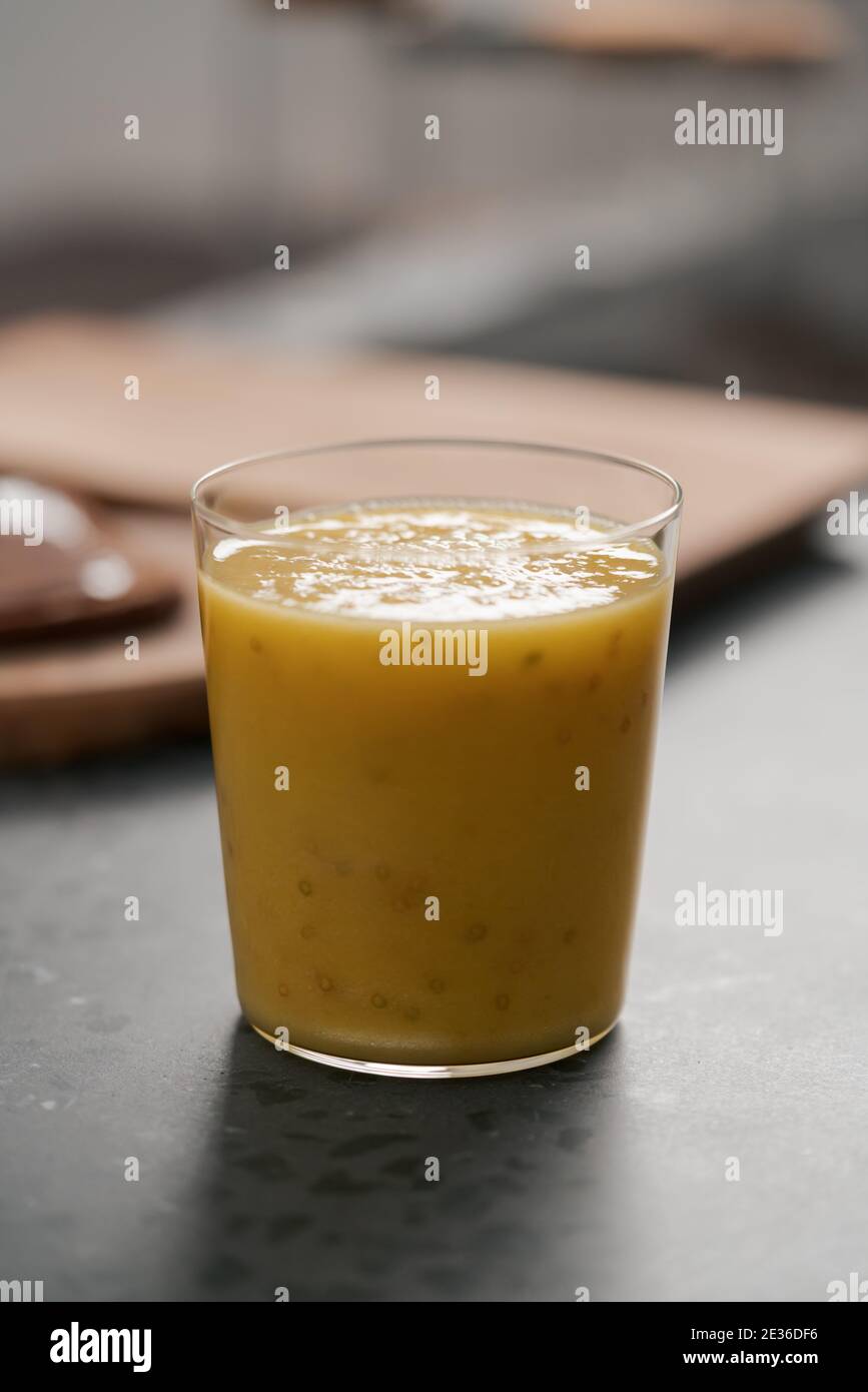 Fresh mango lulo smoothie on kitchen countertop, shallow focus Stock ...