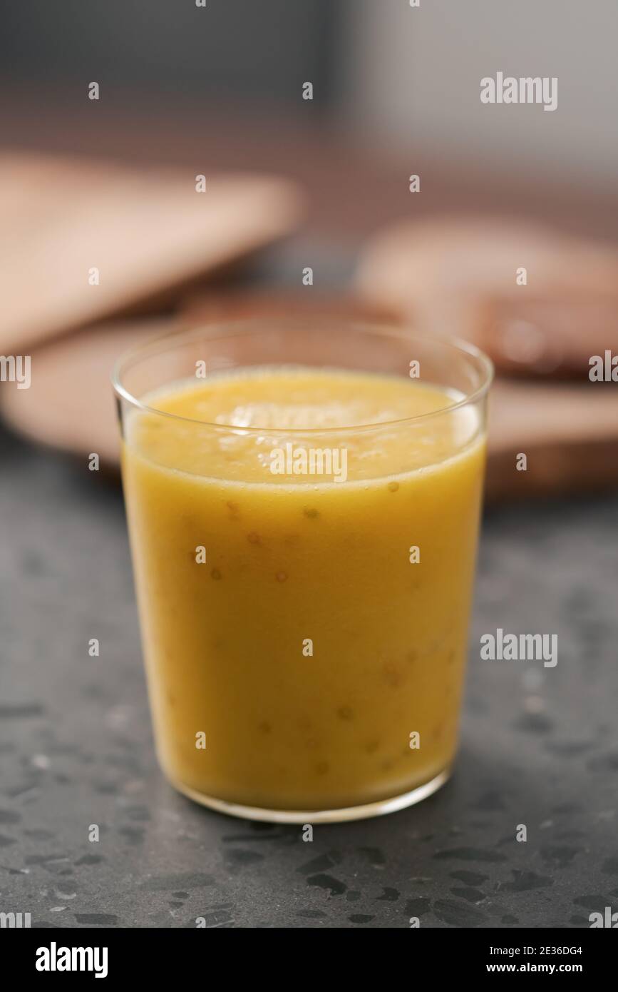 Fresh mango lulo smoothie on kitchen countertop, shallow focus Stock ...