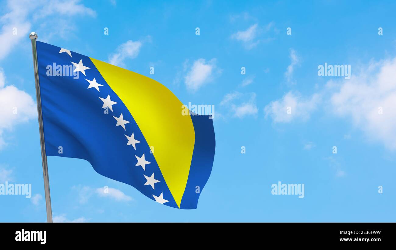 Bosnia and Herzegovina flag on pole. Blue sky. National flag of Bosnia ...